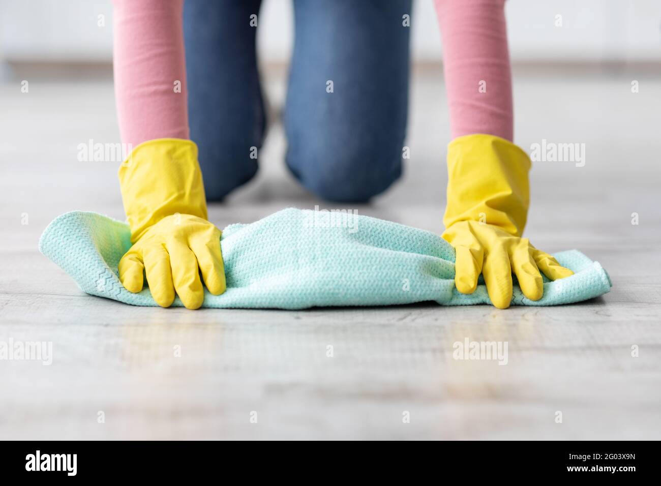Unrecognizable lady cleaning floor, wearing rubber gloves Stock Photo ...