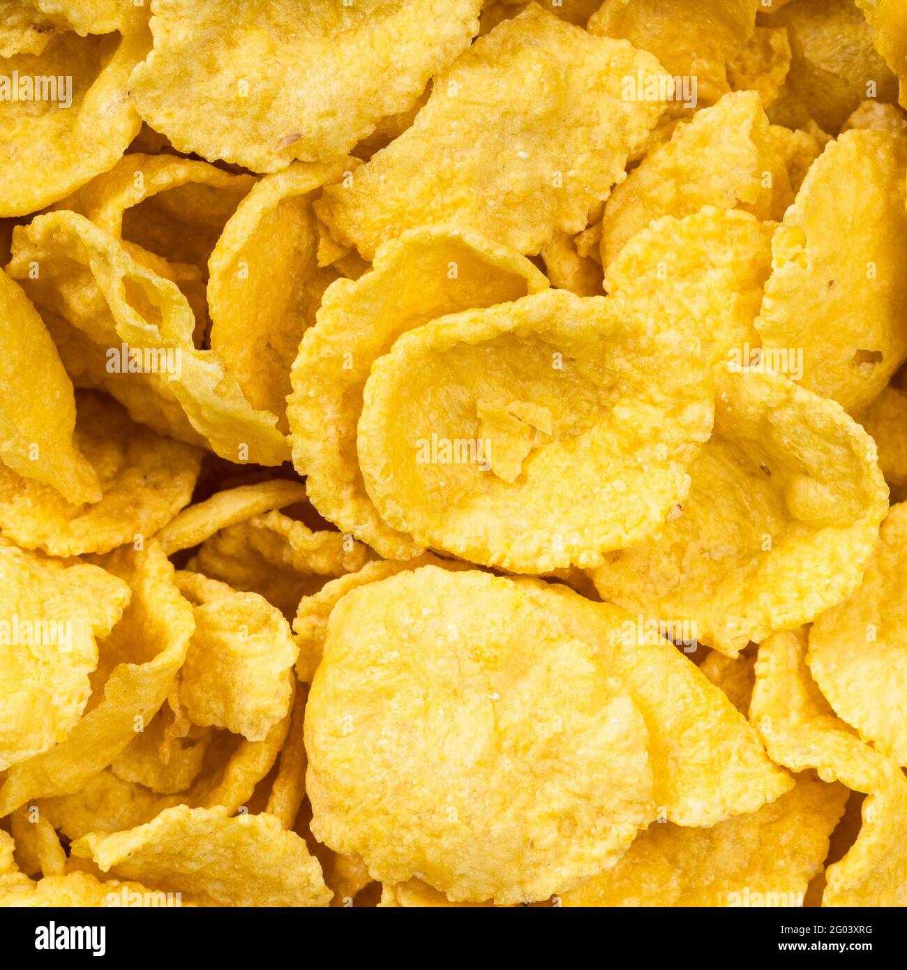 square food background - raw sugar-free corn flakes close up Stock ...