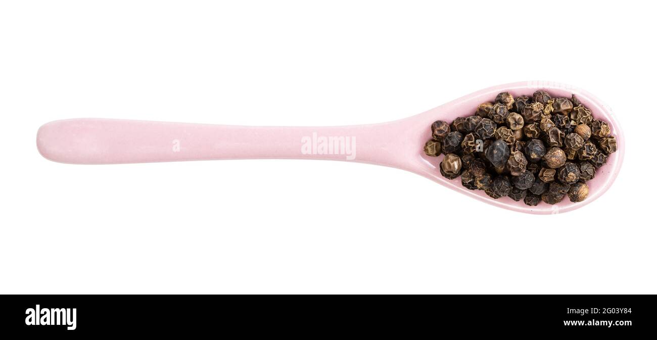 top view of ceramic spoon with black pepper peppercorns isolated on ...