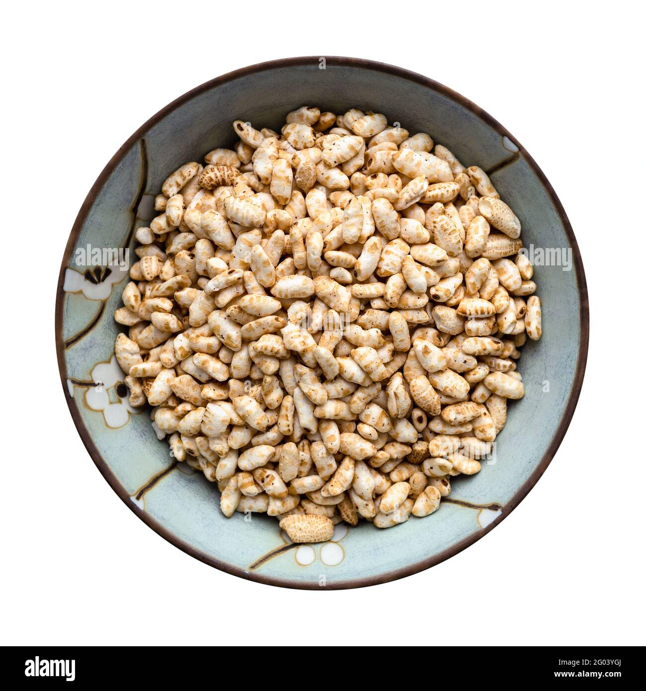 top view of puffed brown rice in ceramic bowl isolated on white ...
