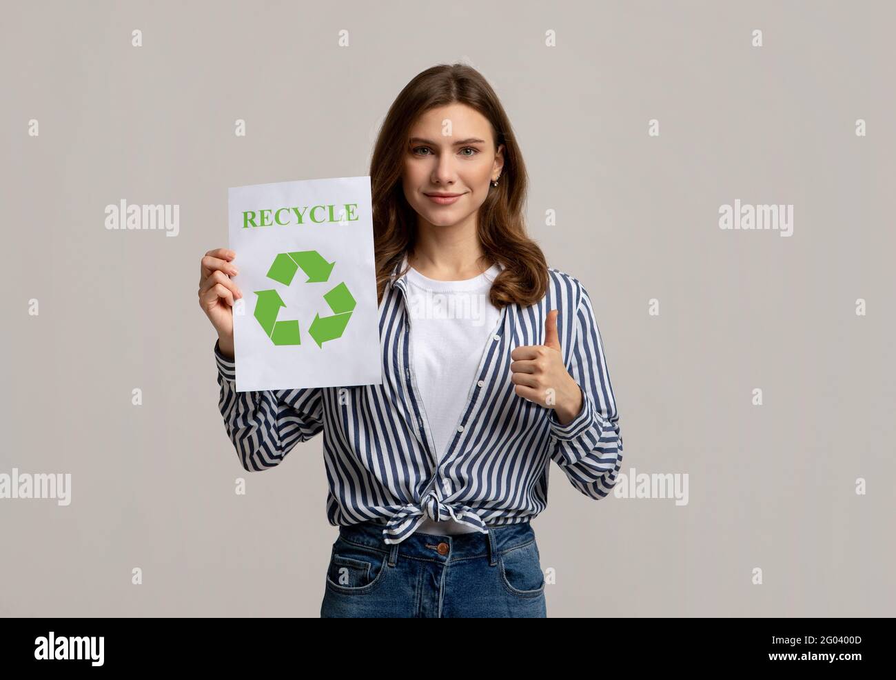 Young Eco-Activist Female Demonstrating Placard With Recycle Sign And ...