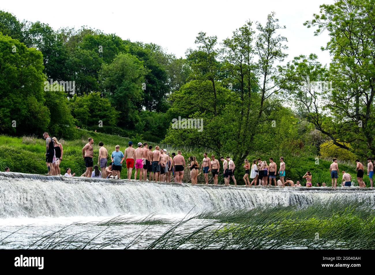 People enjoy the water at Warleigh Weir on the river Avon near Bath in ...