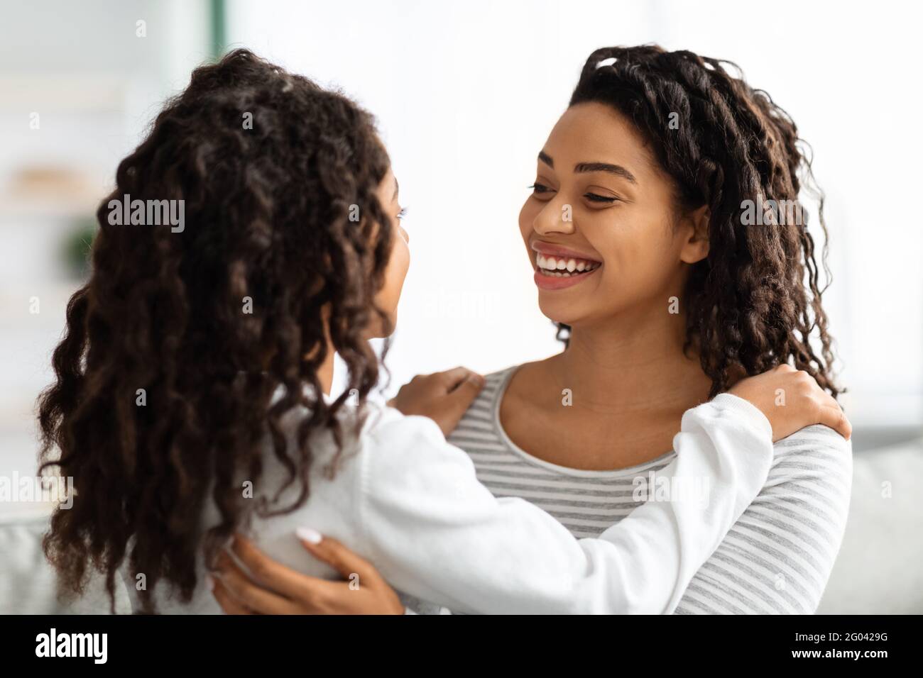 Happy african american mother having fun with her daughter Stock Photo - Alamy