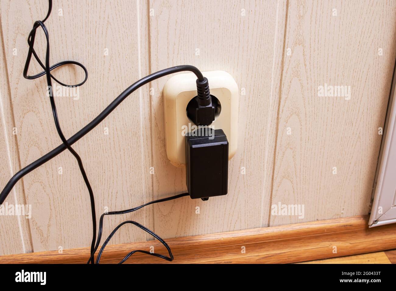 Electrical Wires and Socket on white wall close up Stock Photo - Alamy
