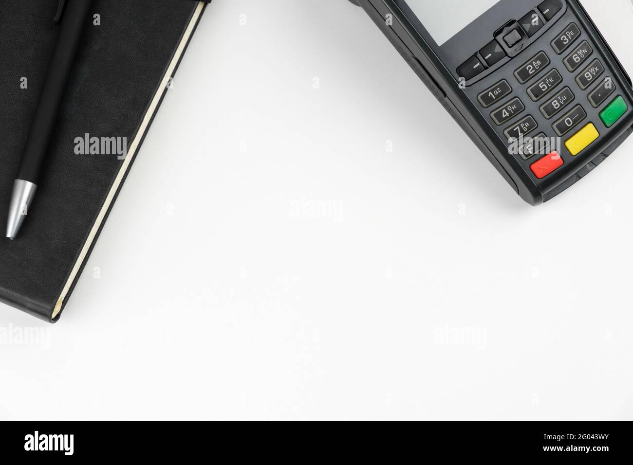 POS terminal or credit card reader machine on the white table with copy ...