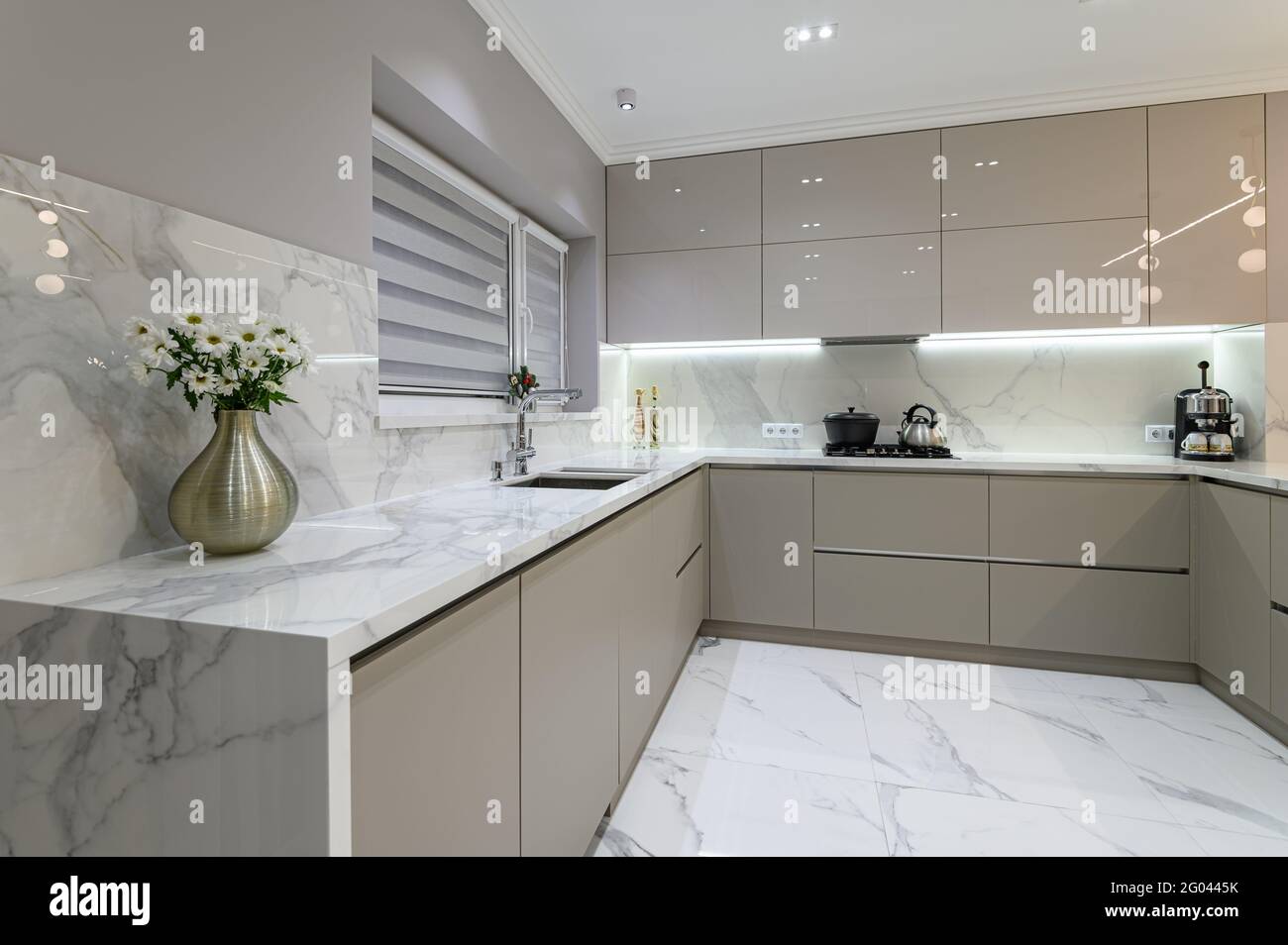 Luxury white modern marble kitchen in studio space Stock Photo - Alamy