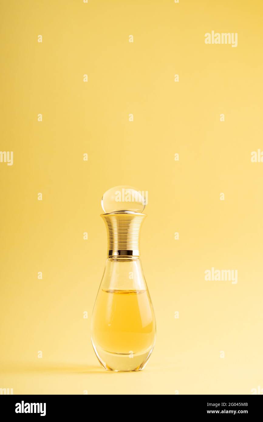 PARIS, FRANCE - May 15, 2021: Dior perfume on the yellow/golden ...