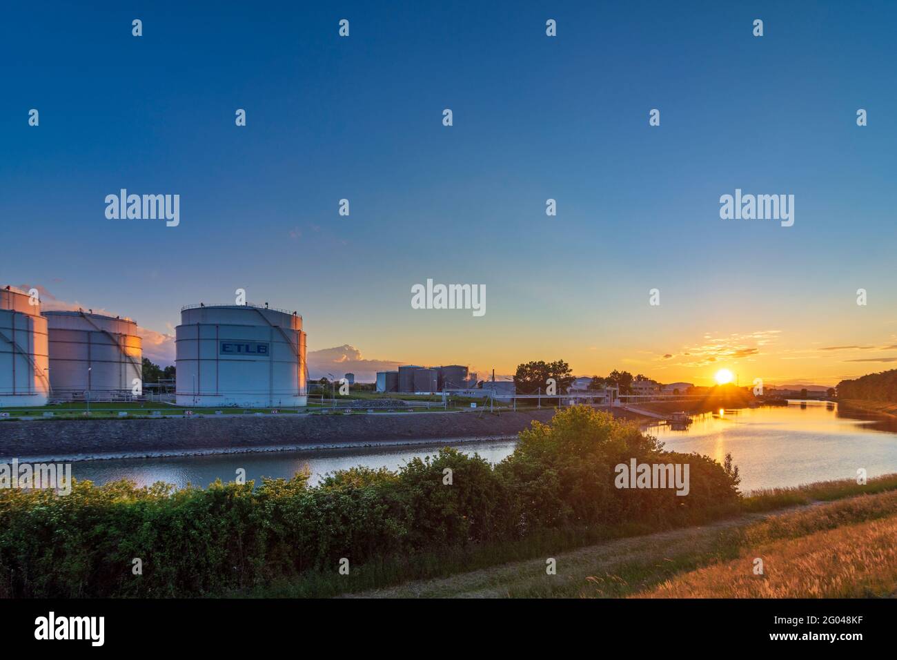 Wien, Vienna: port Ölhafen Lobau, oil storage tanks, cargo ship in 22 ...