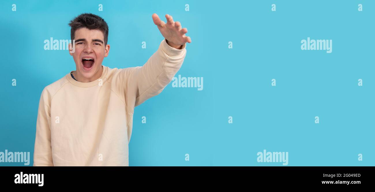 young teenager screaming isolated with raised arm Stock Photo - Alamy