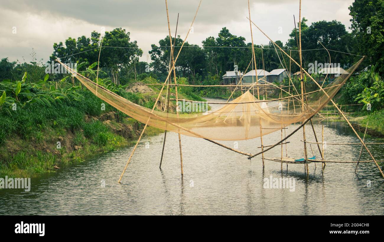 A beautiful river view of Bangladesh. Fishermen fish in the river to ...