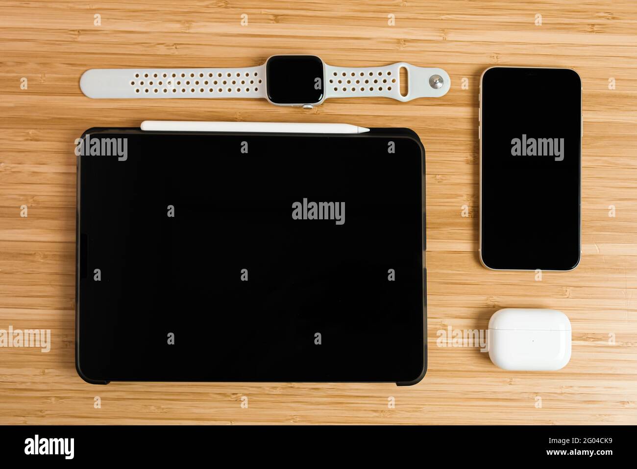 Apple watch, Ipad, iphone, airpods pro on the wooden table, May 2021 ...