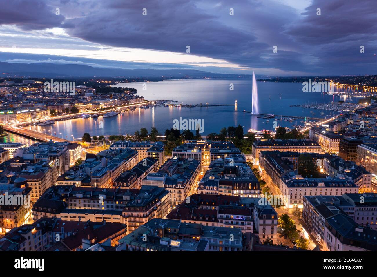 Aerial night view of Geneva city waterfront skyline in Switzerland ...