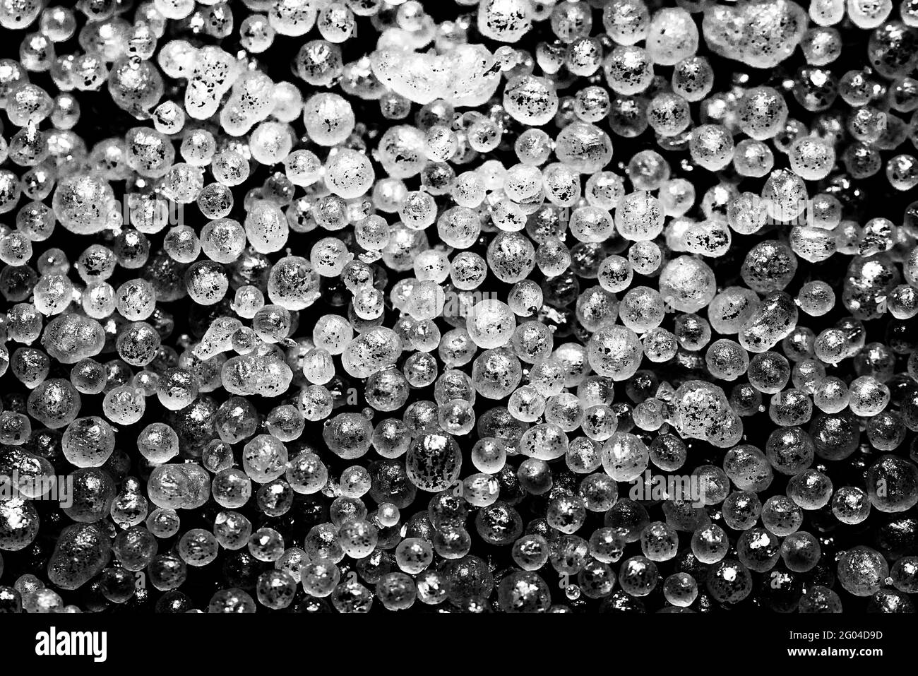 Abstract background with irregular spheres. Pink granules with metallic ...