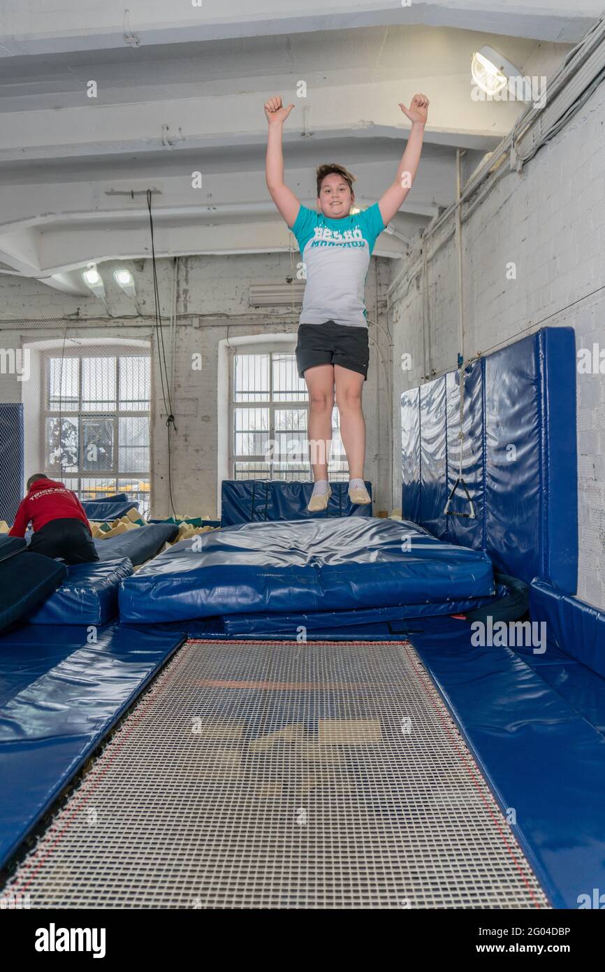 RUSSIA, MOSCOW - Feb 13, 2021 Jumping trampoline in the sports hall and ...