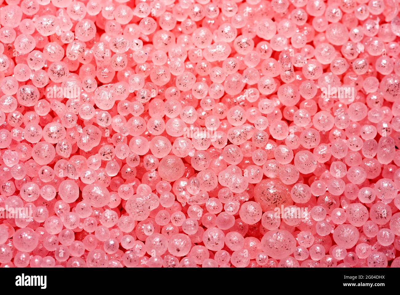 Abstract background with irregular spheres. Pink granules with metallic ...