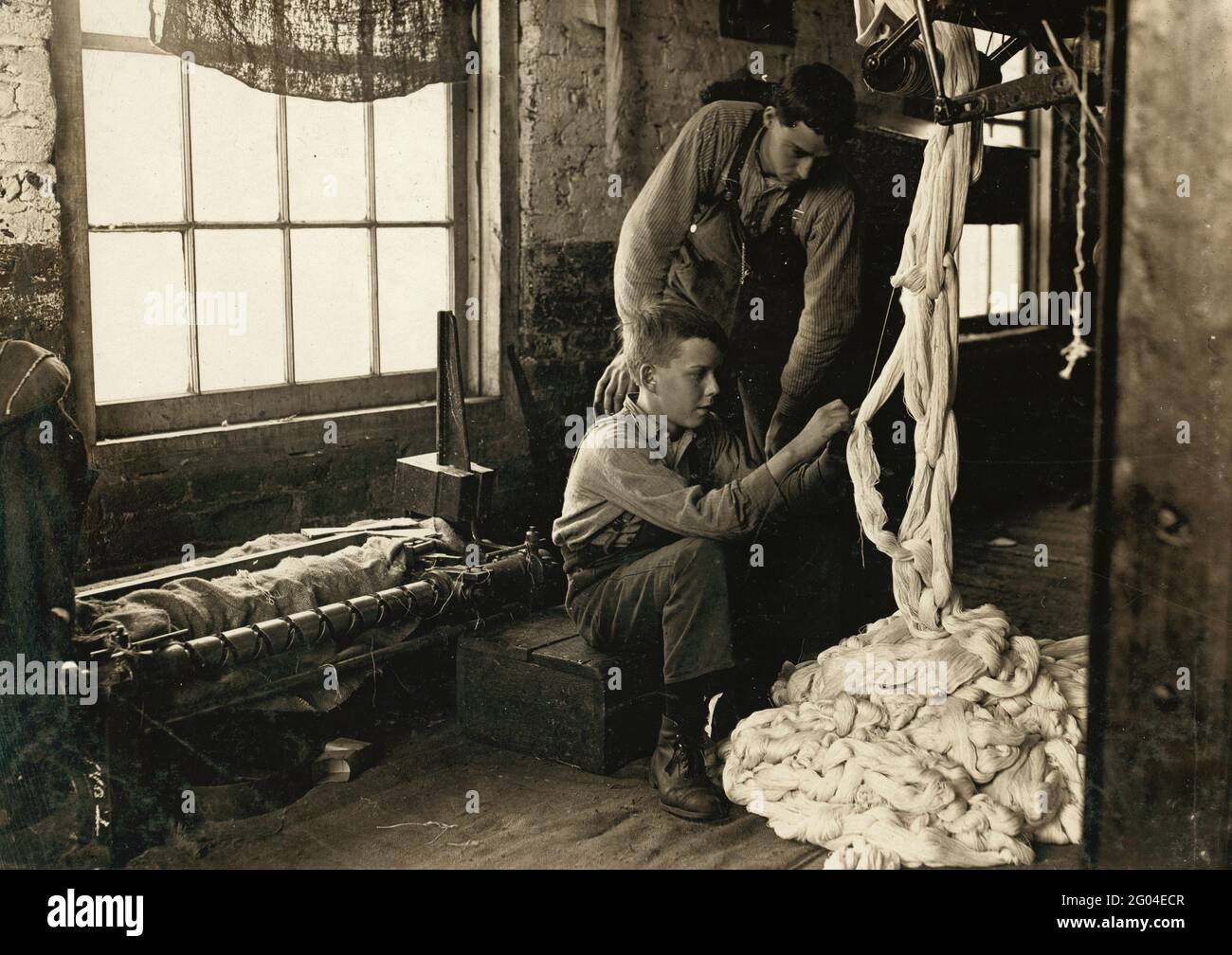 Child Labour: A boy working at the warping machine at Clyde Cotton Mill ...
