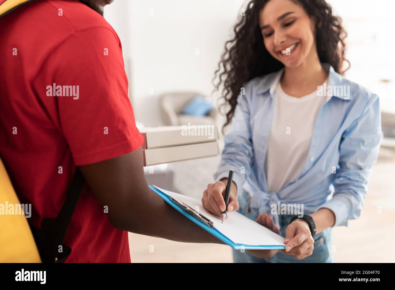 Smiling Customer Receiving Order From Restaurant Signing Paper Form ...