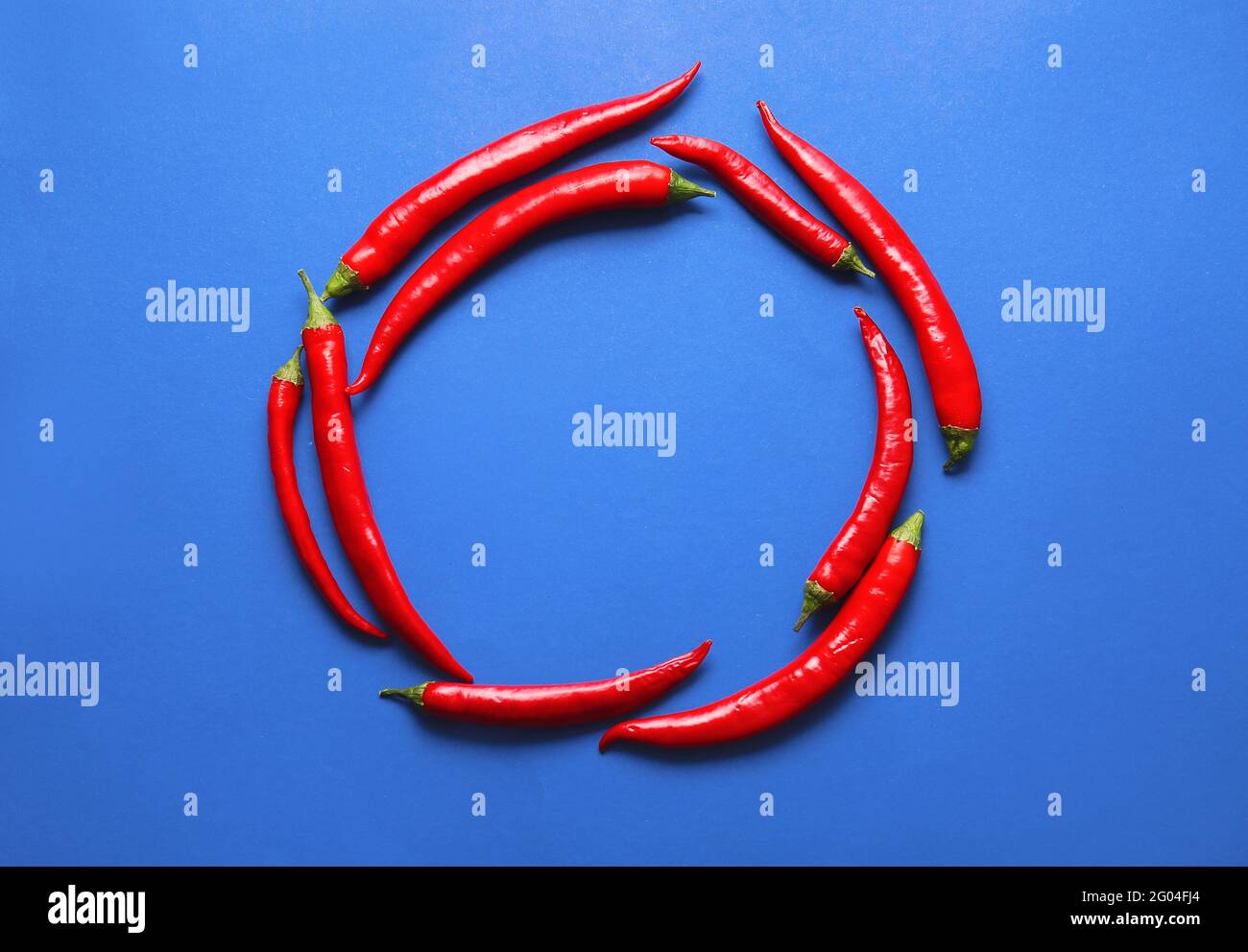 Frame made of hot chili peppers on color background Stock Photo - Alamy