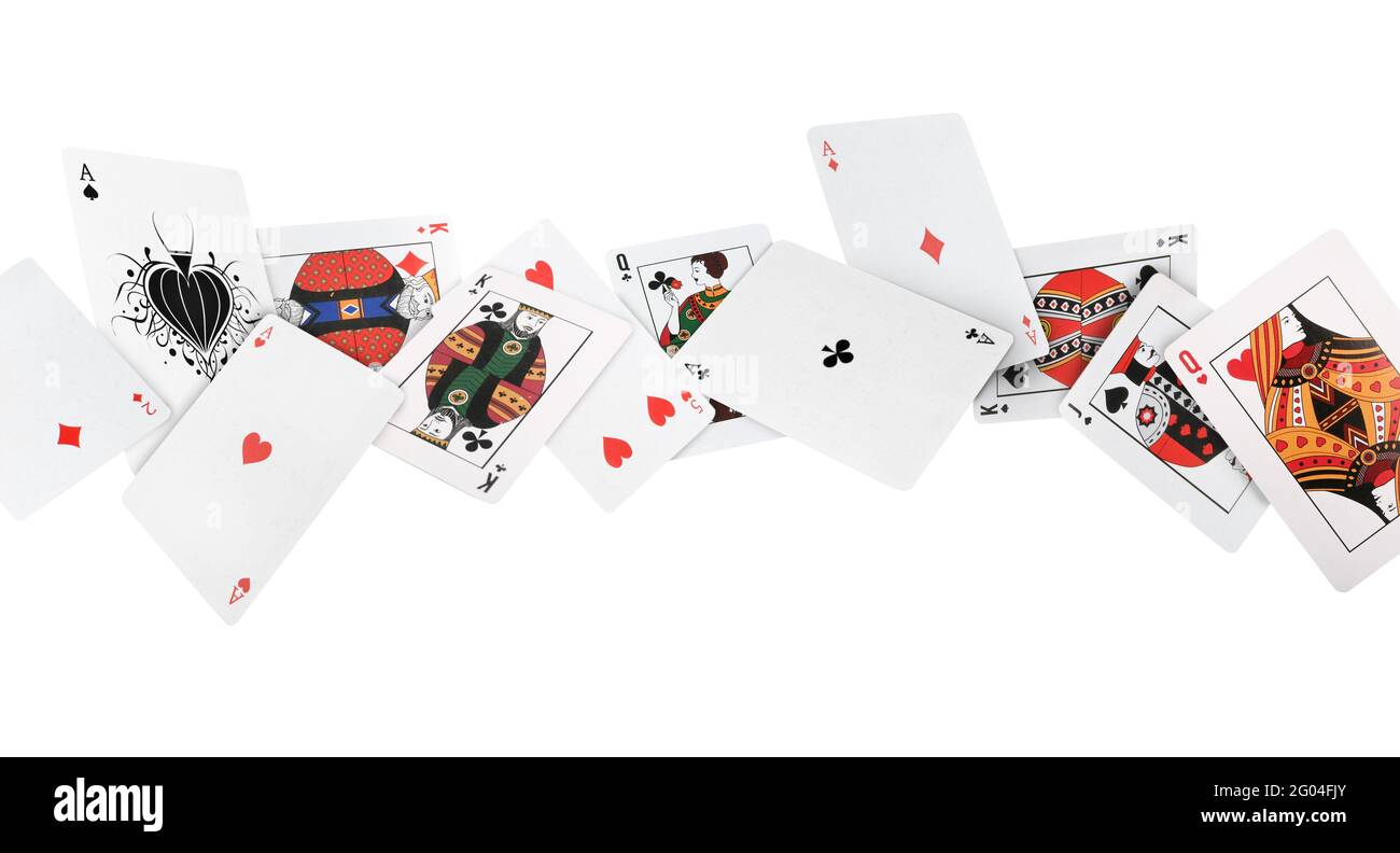 Flying playing cards on white background Stock Photo - Alamy