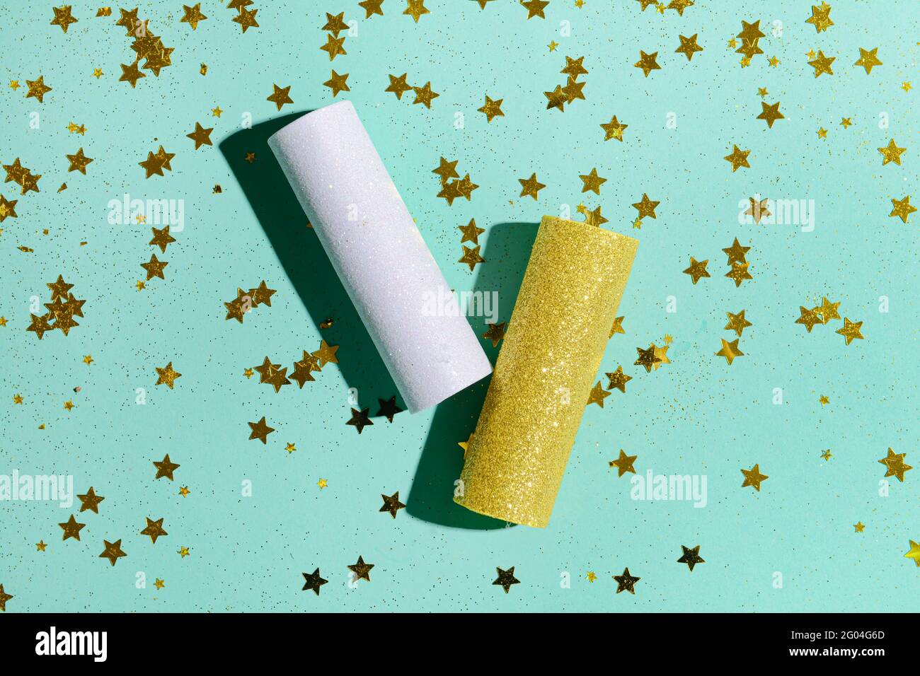 Party poppers and confetti on color background Stock Photo - Alamy