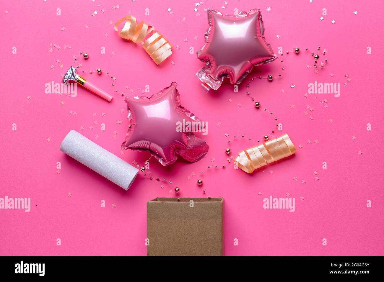 Party set with confetti on color background Stock Photo - Alamy