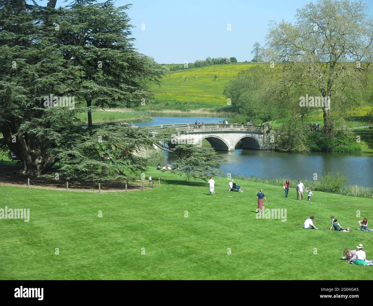 View of the parkland and triple-arched Adam bridge with visitors on the ...