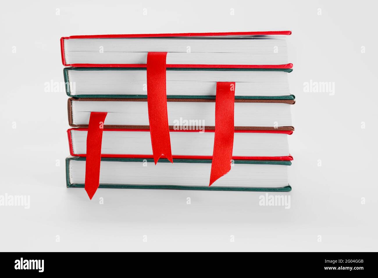 Books with bookmarks on white background Stock Photo - Alamy