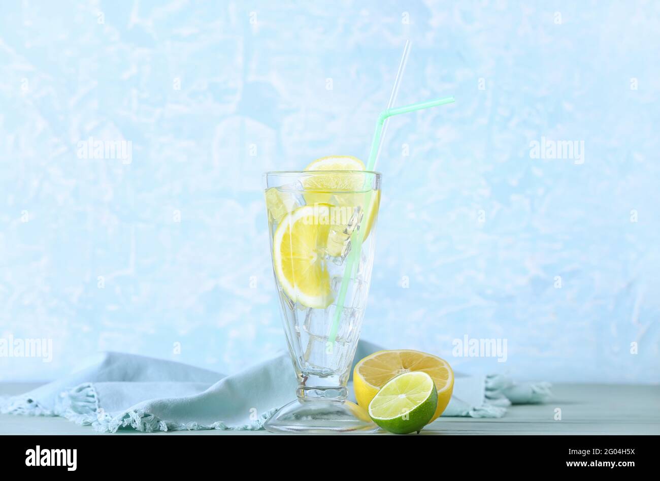 Glass of tasty cold lemonade on color background Stock Photo - Alamy