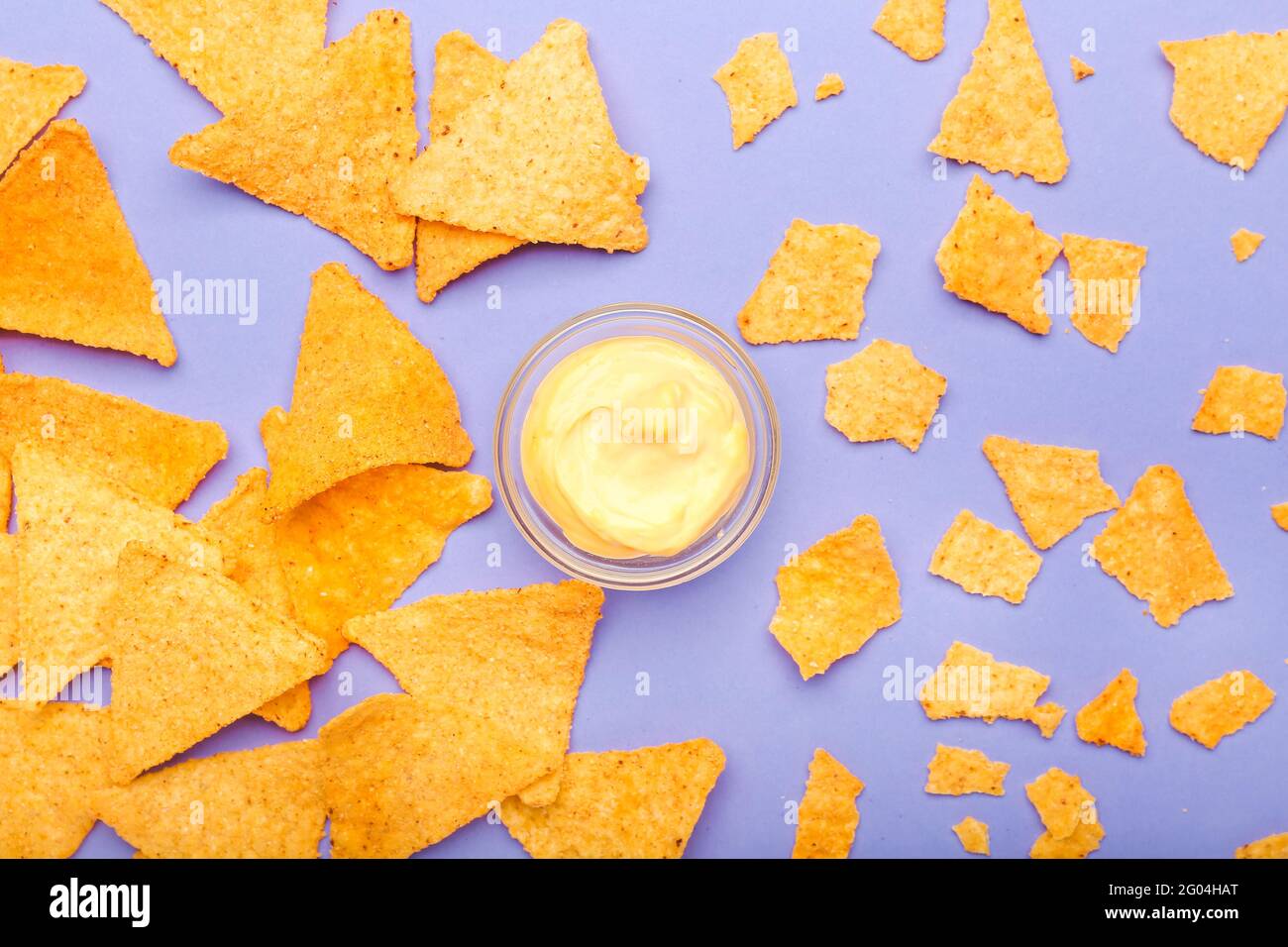 Tasty nachos with sauce on color background Stock Photo - Alamy
