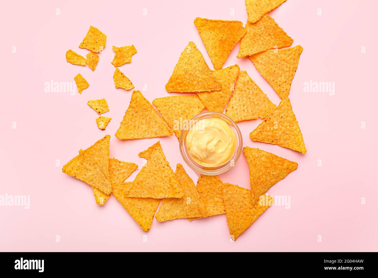 Tasty nachos with sauce on color background Stock Photo - Alamy
