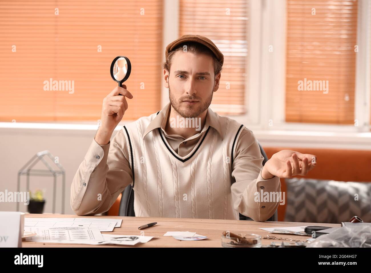 Detective processing evidence in office Stock Photo - Alamy
