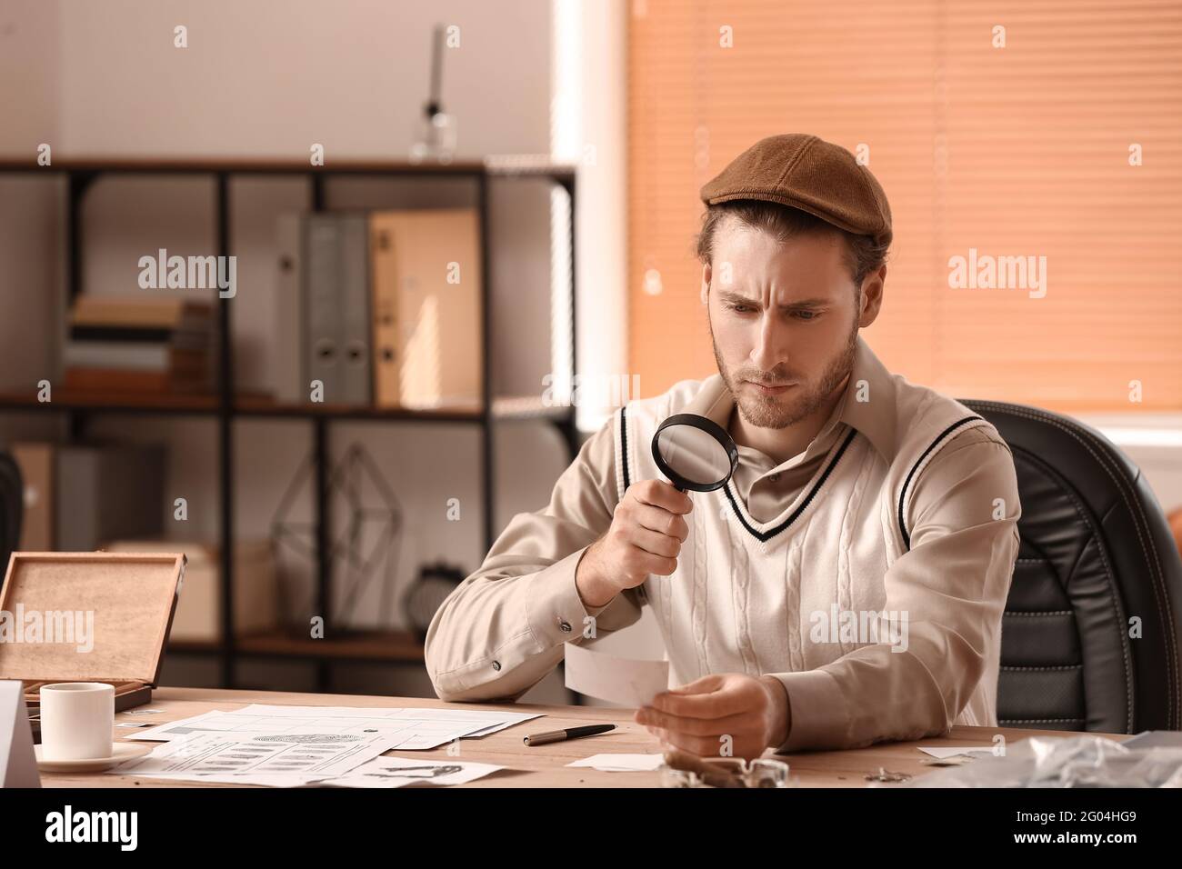 Detective processing evidence in office Stock Photo - Alamy