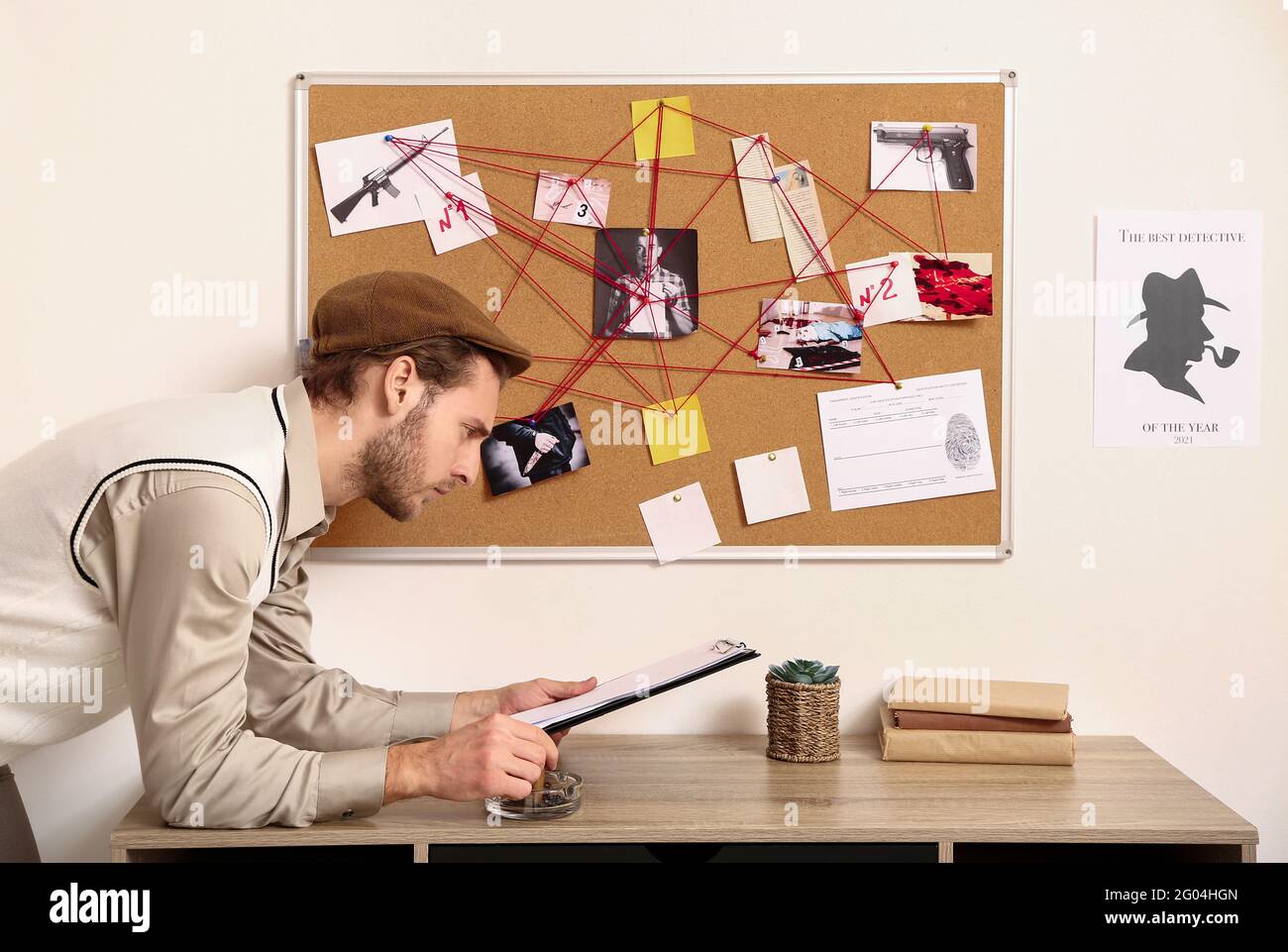 Detective processing evidence in office Stock Photo - Alamy