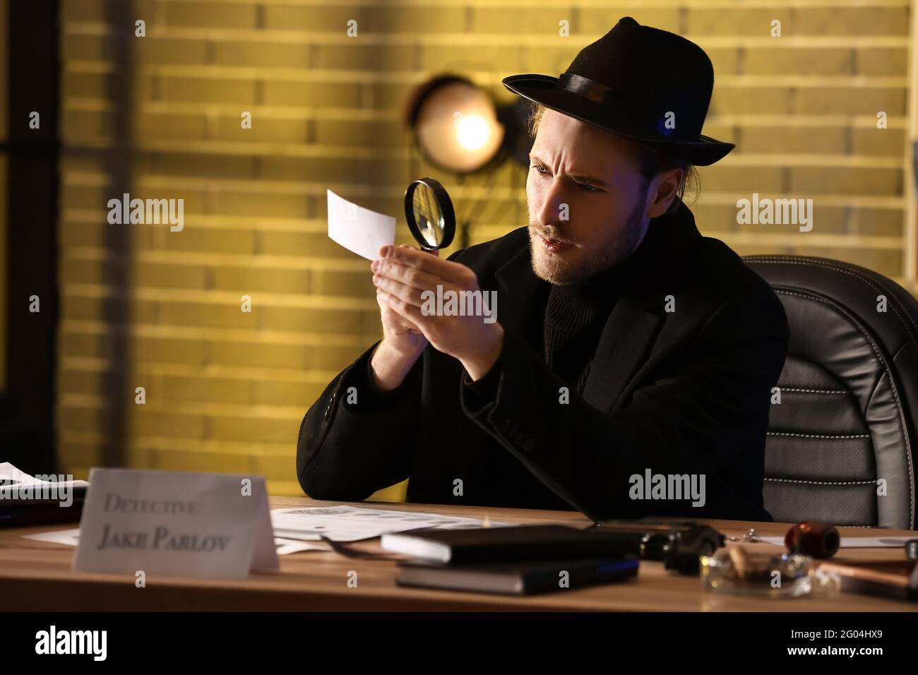 Detective processing evidence in office Stock Photo - Alamy