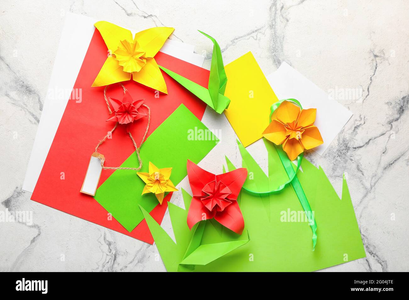 Origami narcissus with paper on white background Stock Photo - Alamy