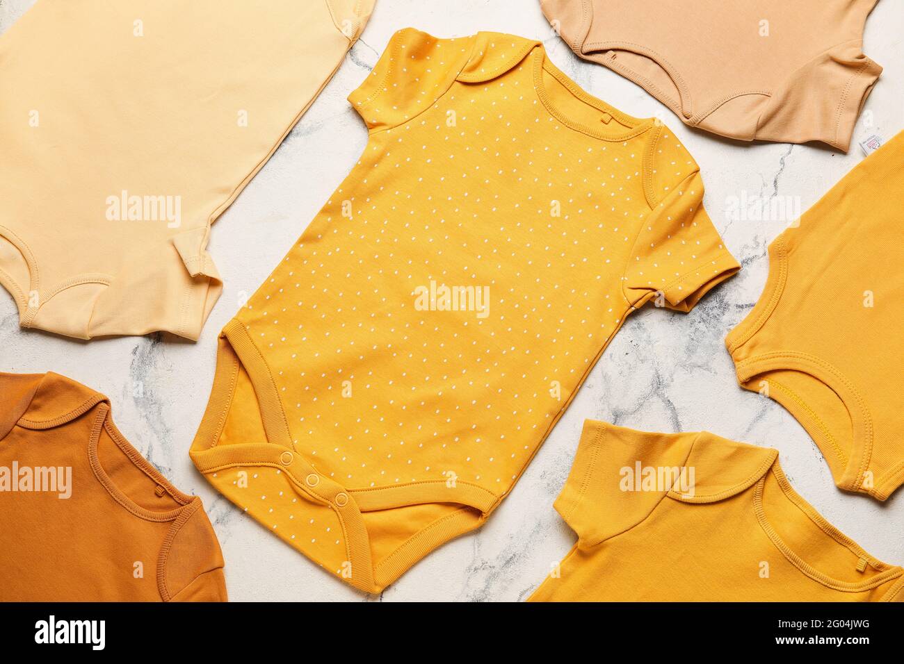 Baby clothes on light background Stock Photo - Alamy