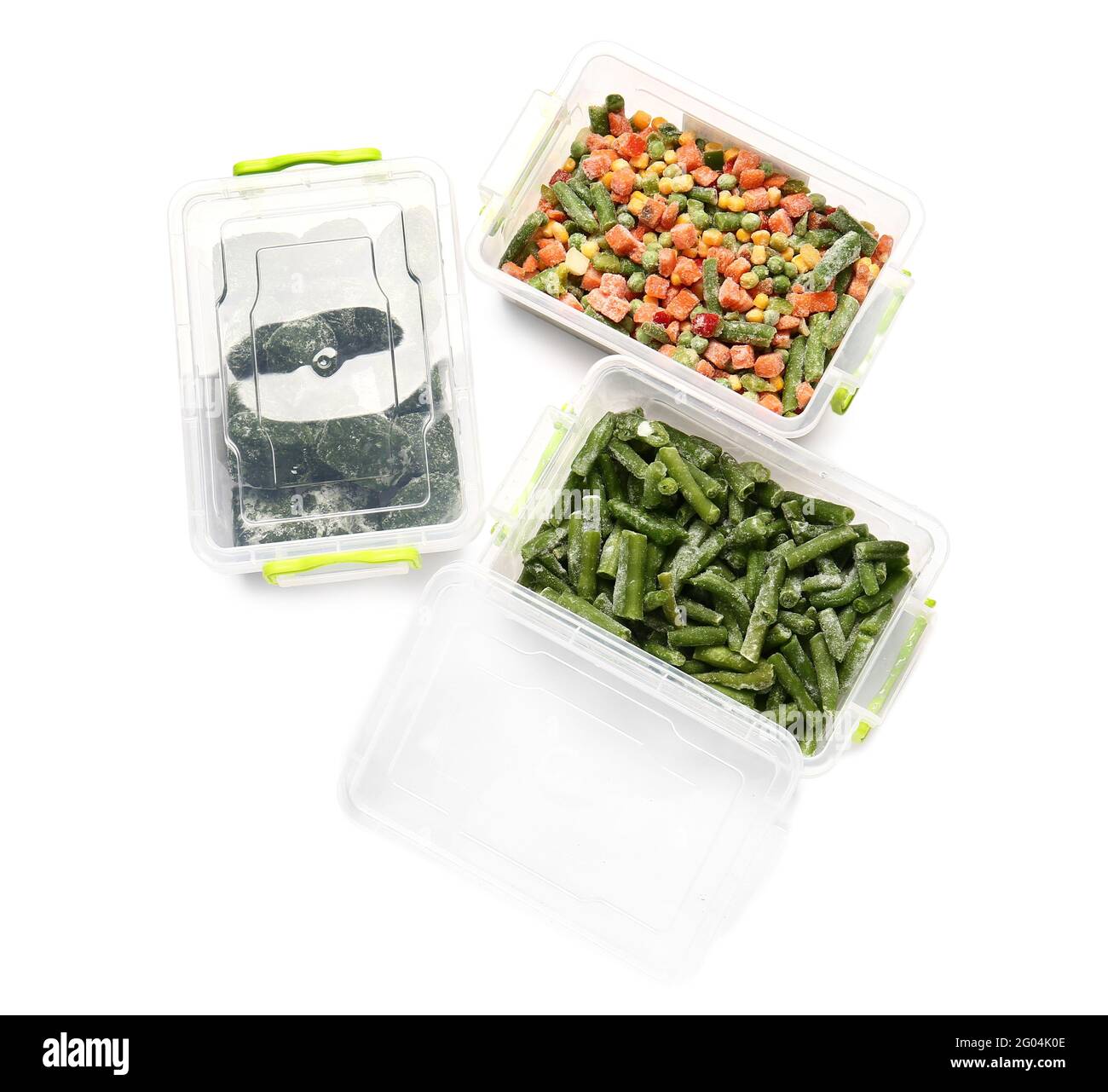 Plastic containers with frozen vegetables on white background Stock ...