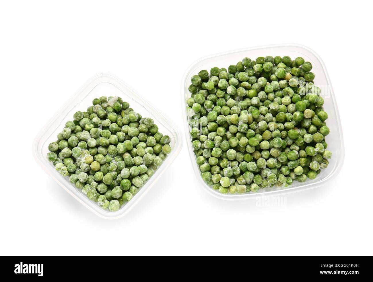 Plastic containers with frozen green peas on white background Stock ...
