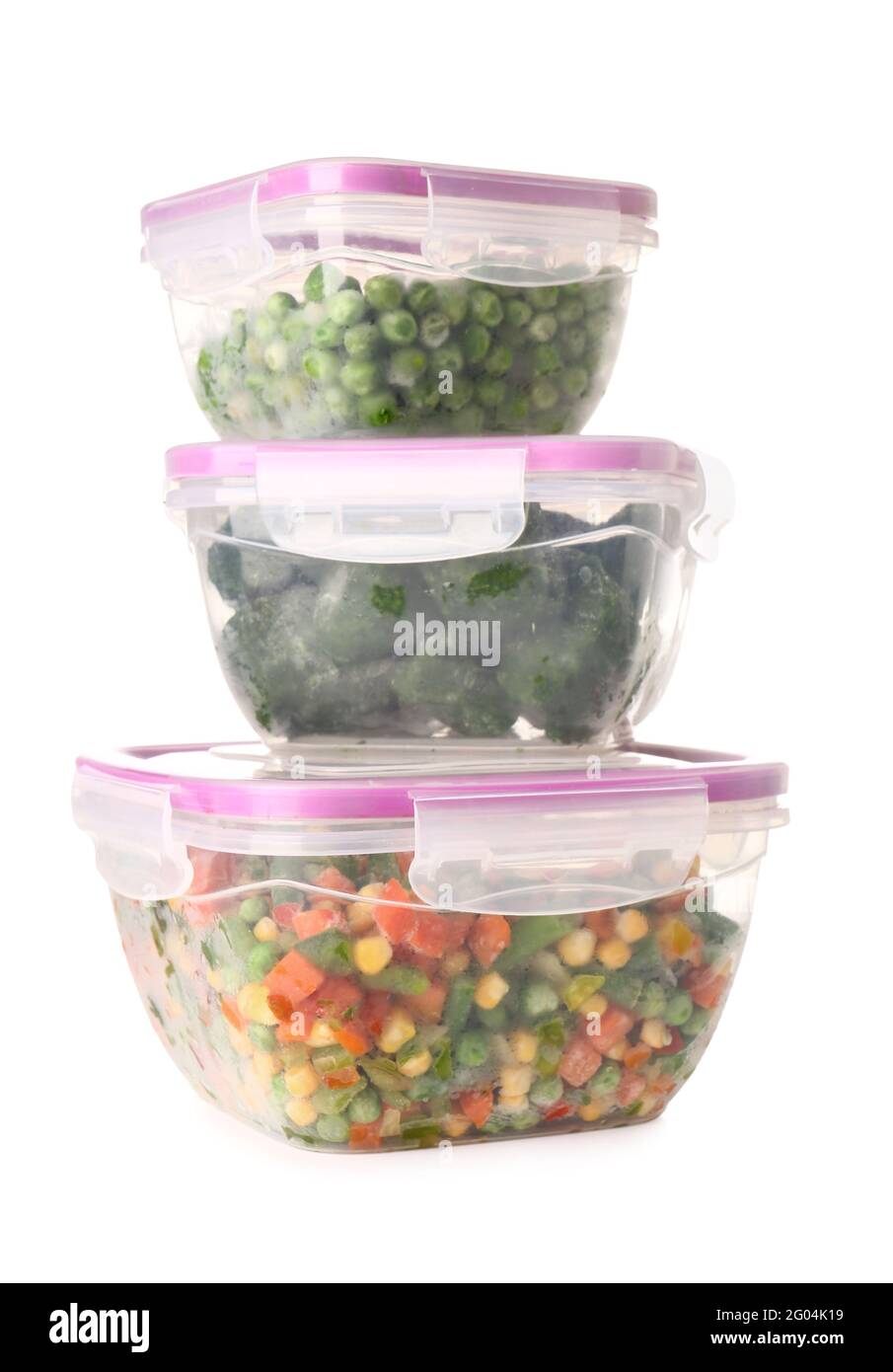 Plastic containers with frozen vegetables on white background Stock ...