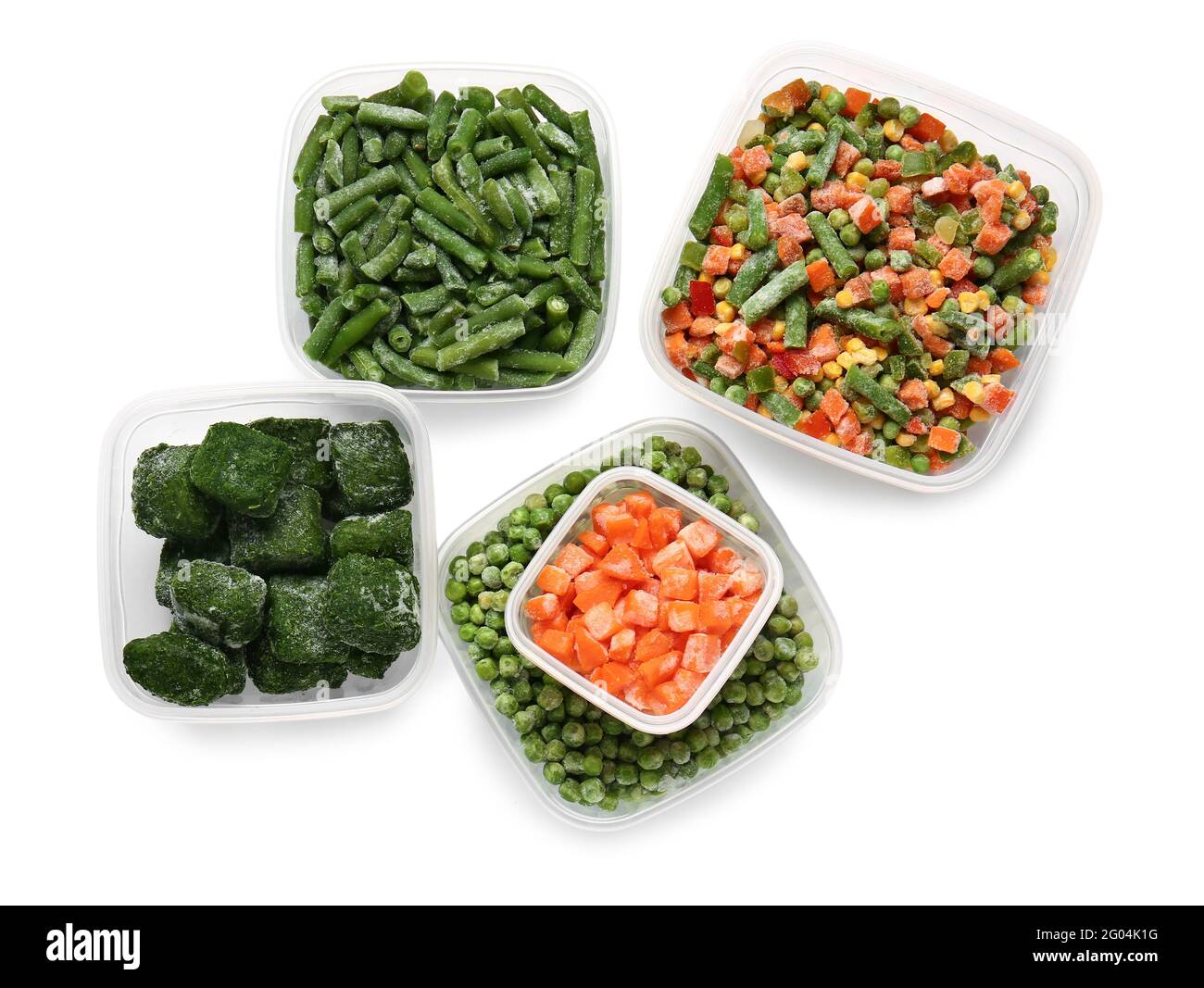 Plastic containers with frozen vegetables on white background Stock ...