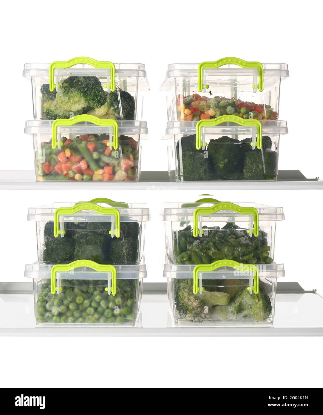 Plastic containers with frozen vegetables on white background Stock ...