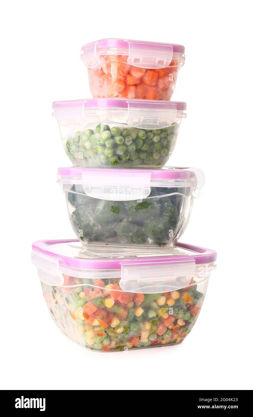 Plastic containers with frozen vegetables on white background Stock ...