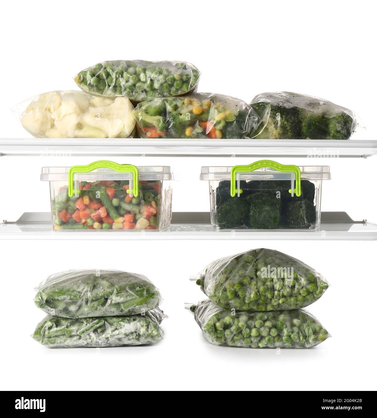 Plastic containers with frozen vegetables on white background Stock ...