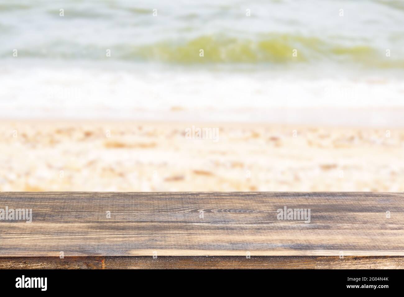 wood table top on blur seaside beach with shells background Stock Photo ...