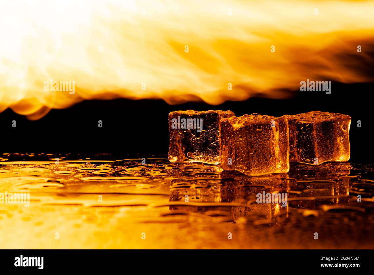fire and ice, ice cubes and flames, black background Stock Photo - Alamy