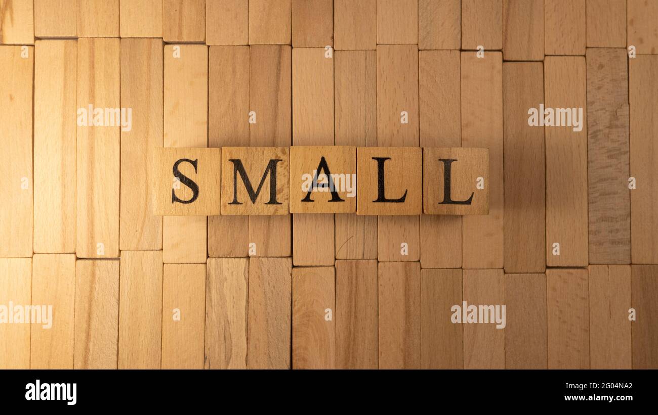 The word small created from wooden cubes Stock Photo - Alamy