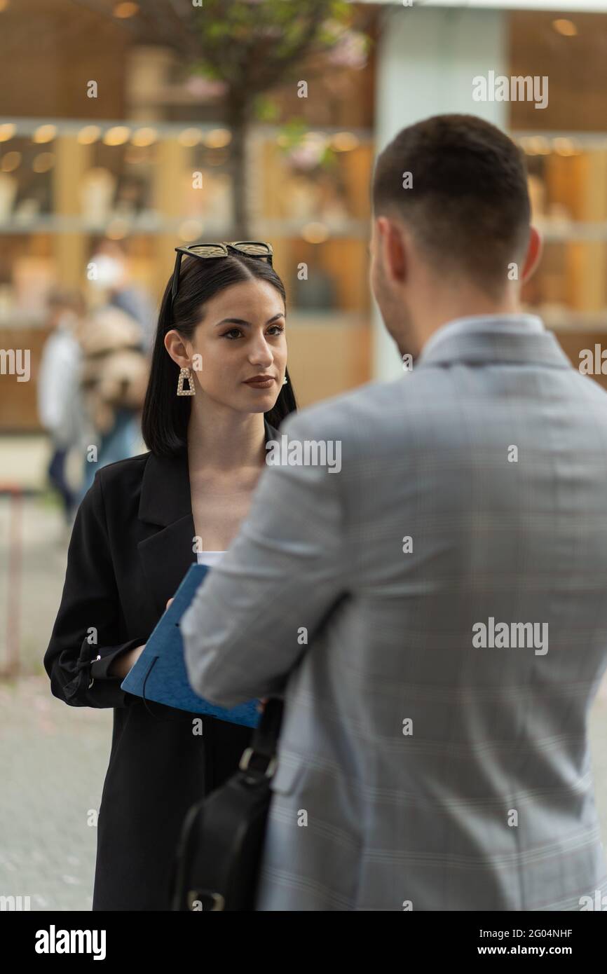 Two business people are having a serious conversation about the plans ...