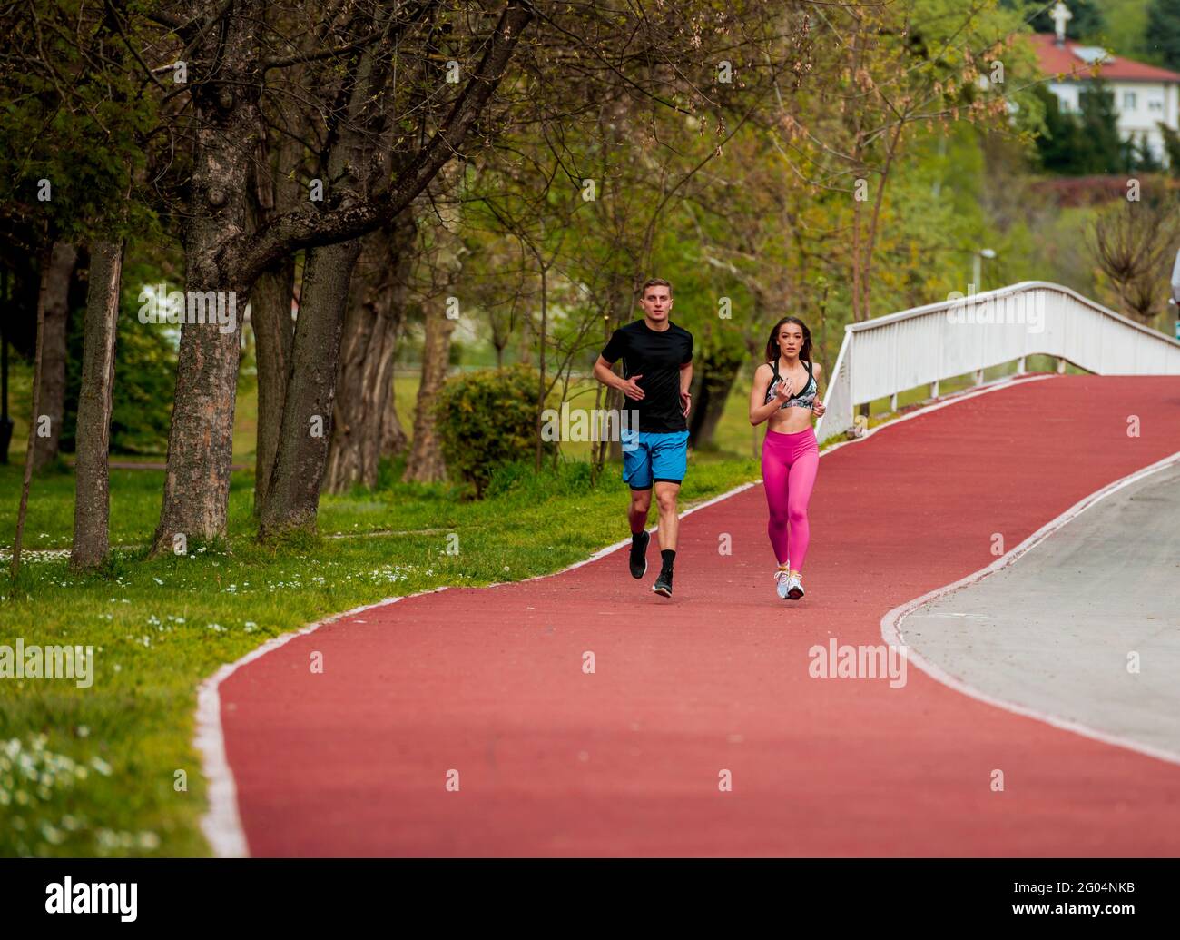 Portrait of a young happy couple racing each other and having some fun ...