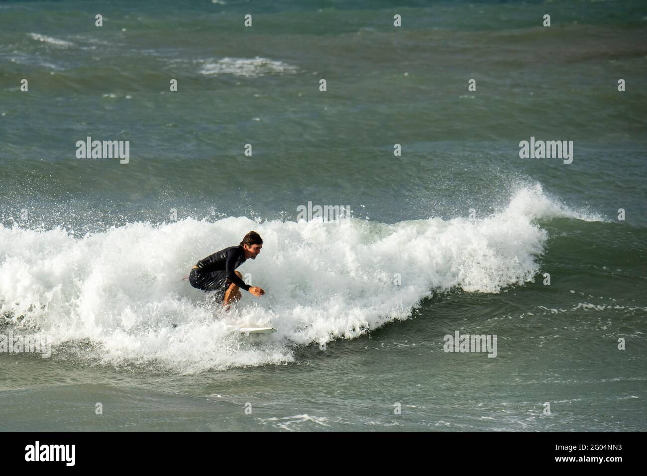Maui, Hawaii. Surfer riding the waves in the pacific ocean Stock Photo ...