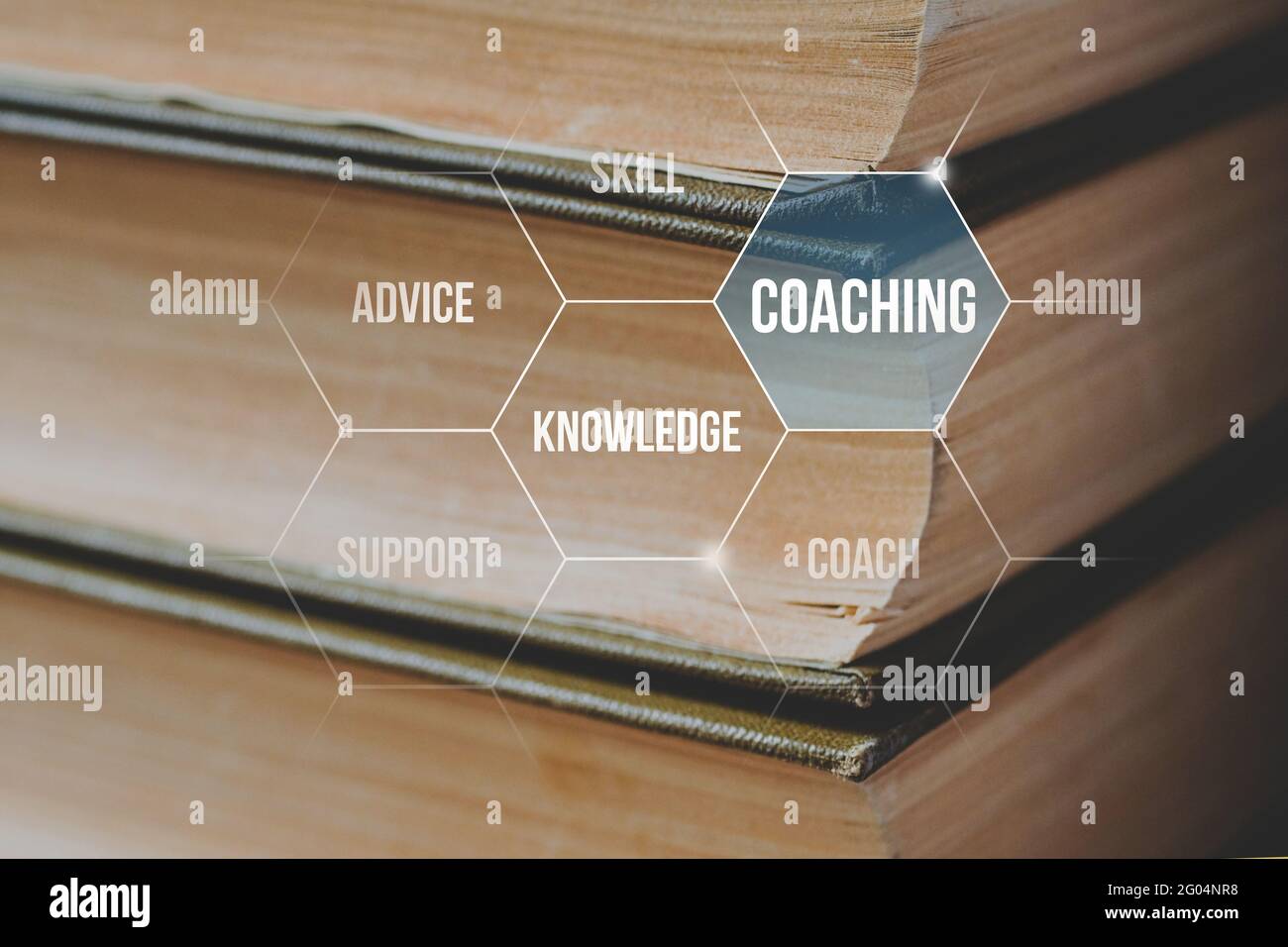 coaching and training concept on the background of a stack of books ...